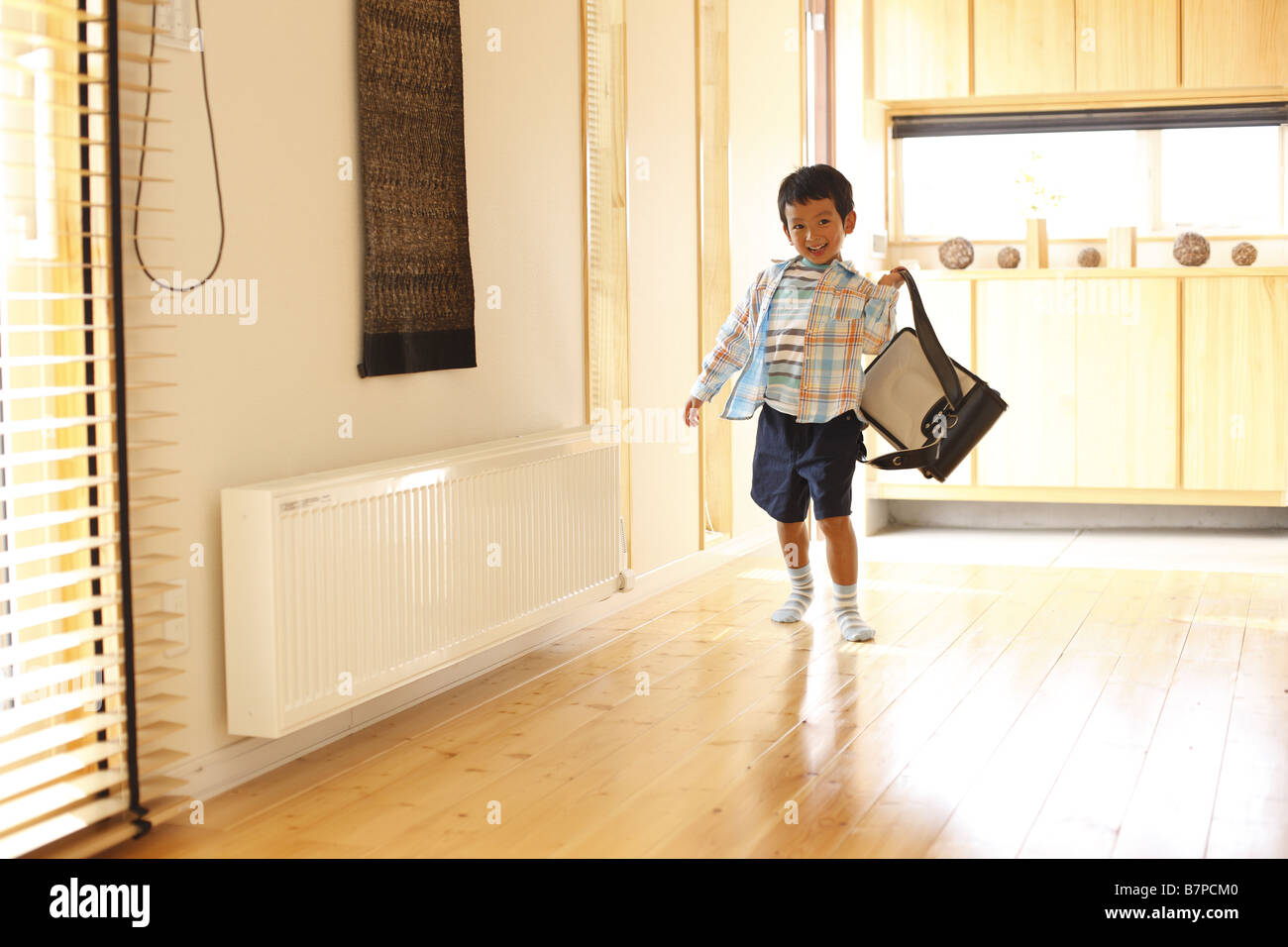 A boy coming home Stock Photo - Alamy