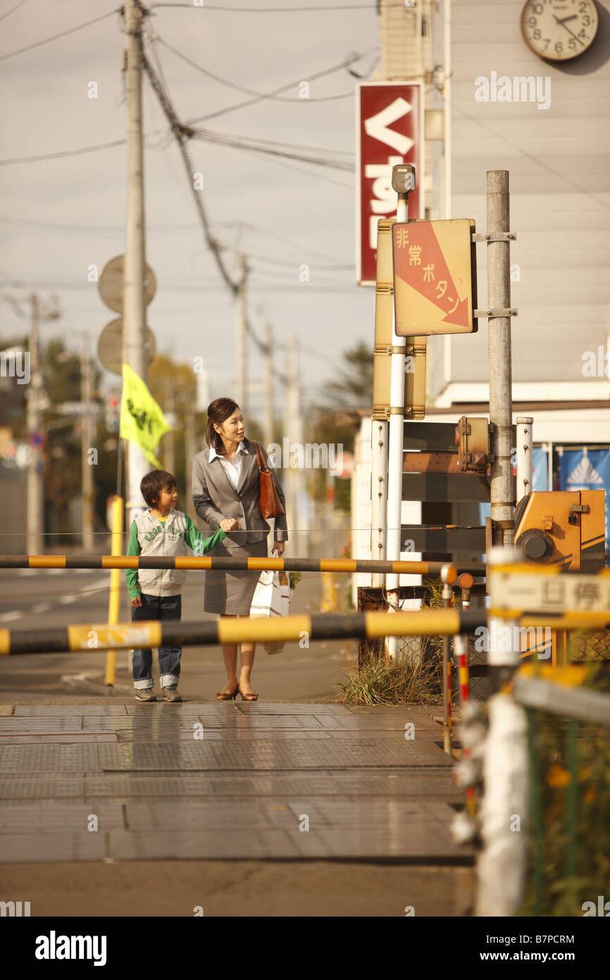 Mother and child on their way home Stock Photo - Alamy