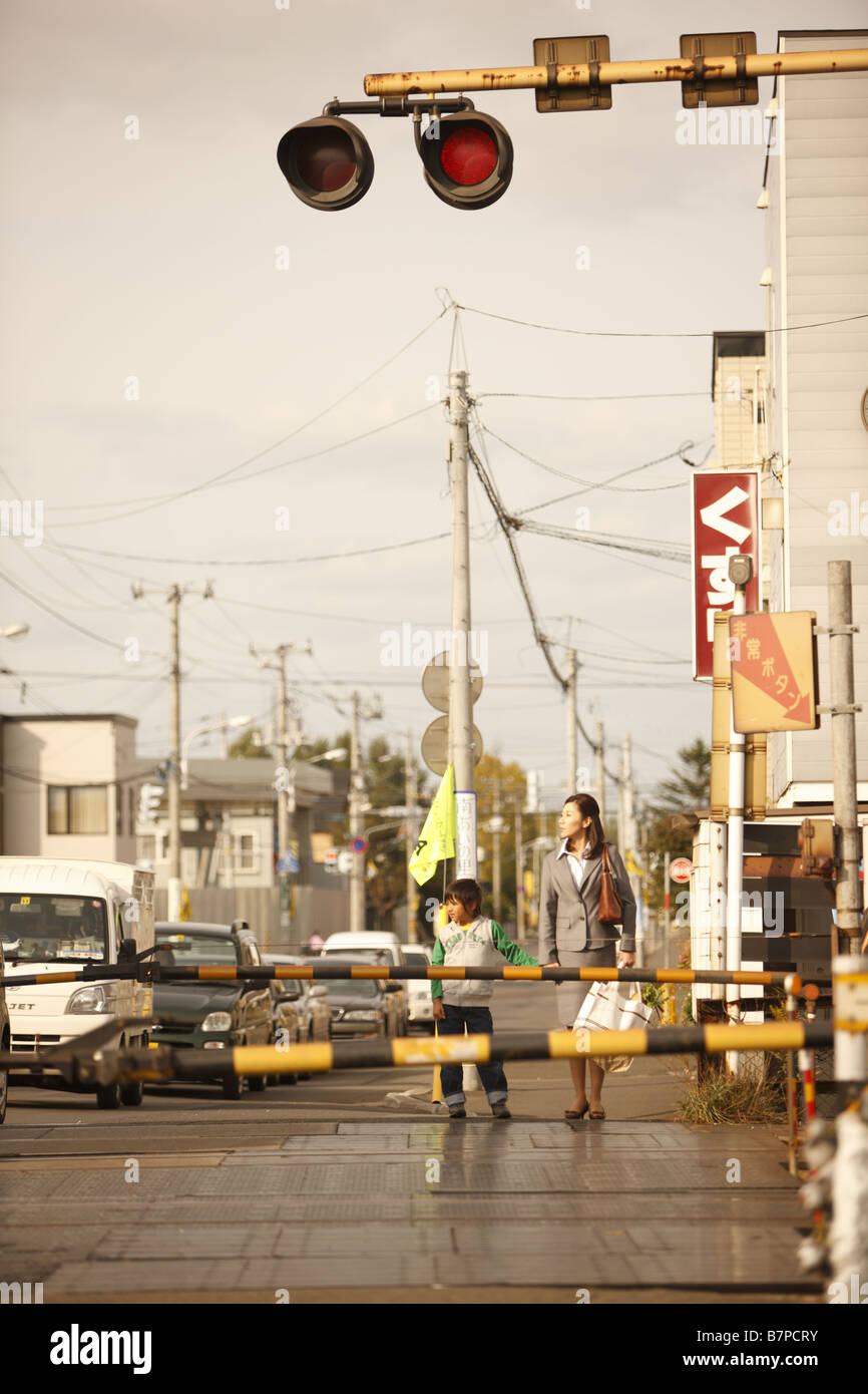 Mother and child on their way home Stock Photo - Alamy