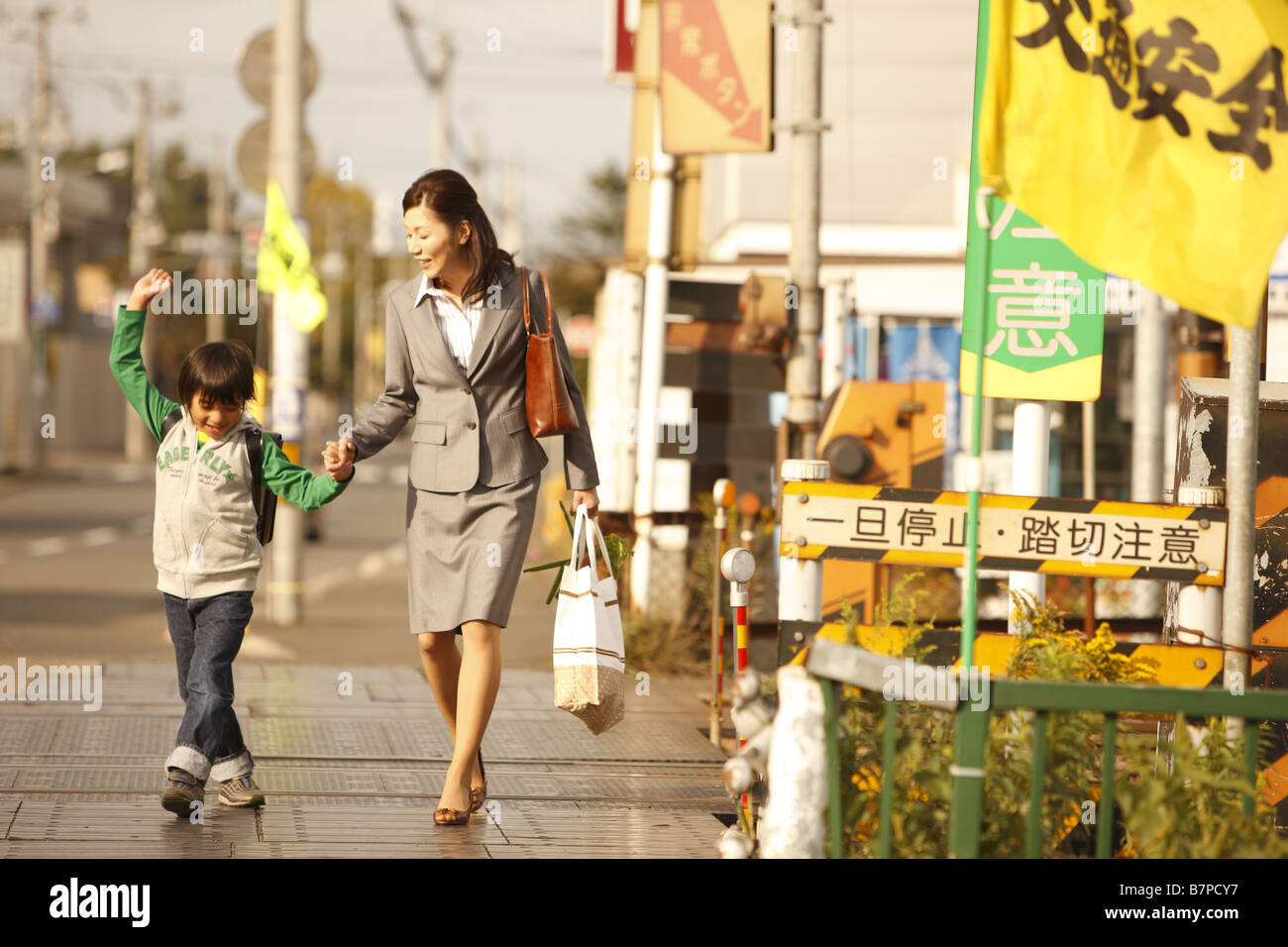 Mother and child on their way home Stock Photo - Alamy