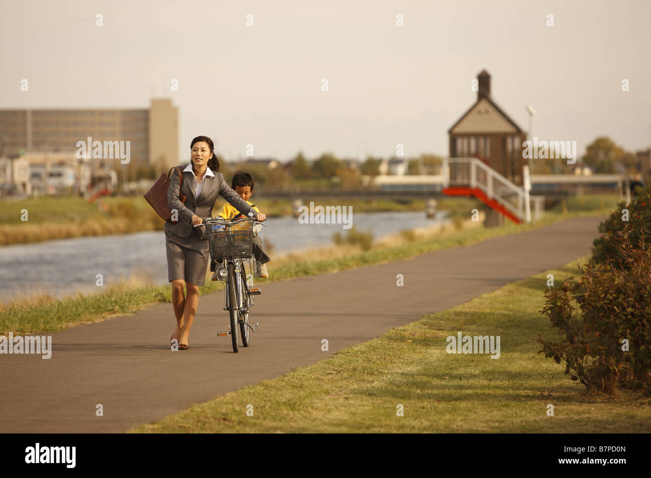 Mother and child on their way home Stock Photo - Alamy