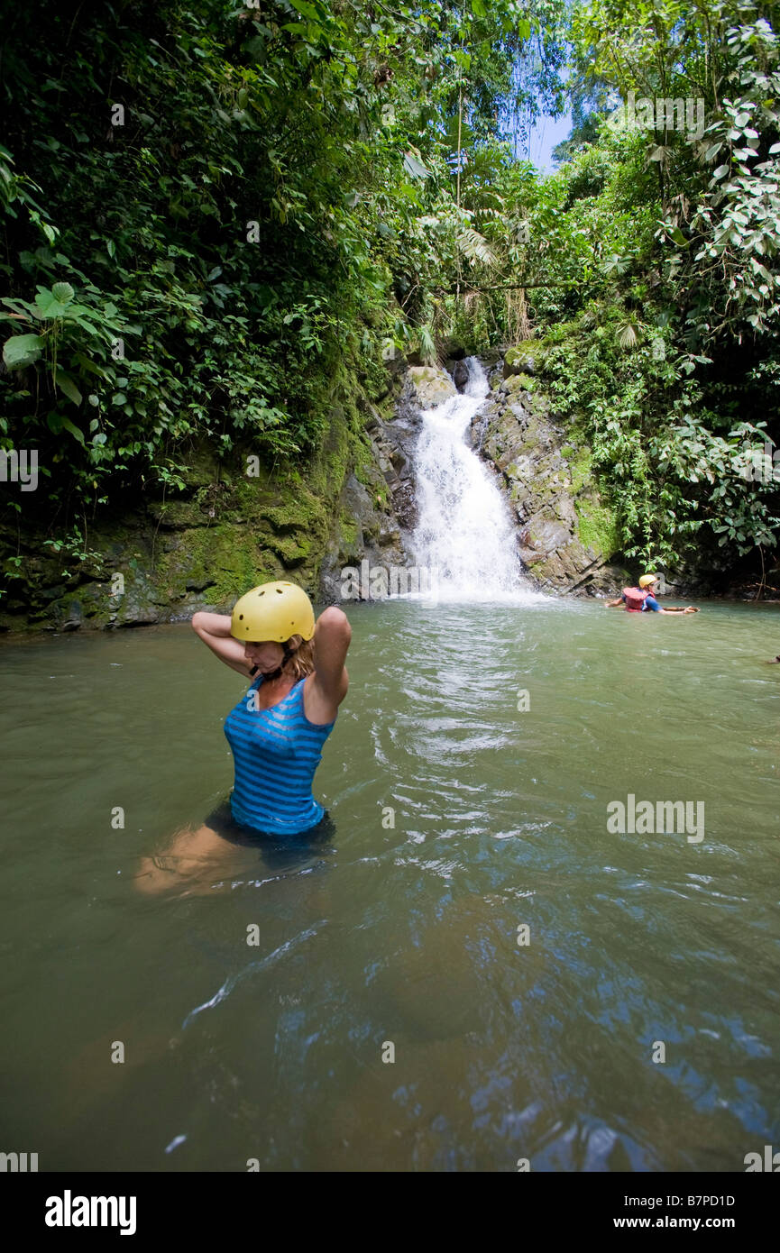 Central America, Costa Rica. Rafters explore a creek that leads to a ...
