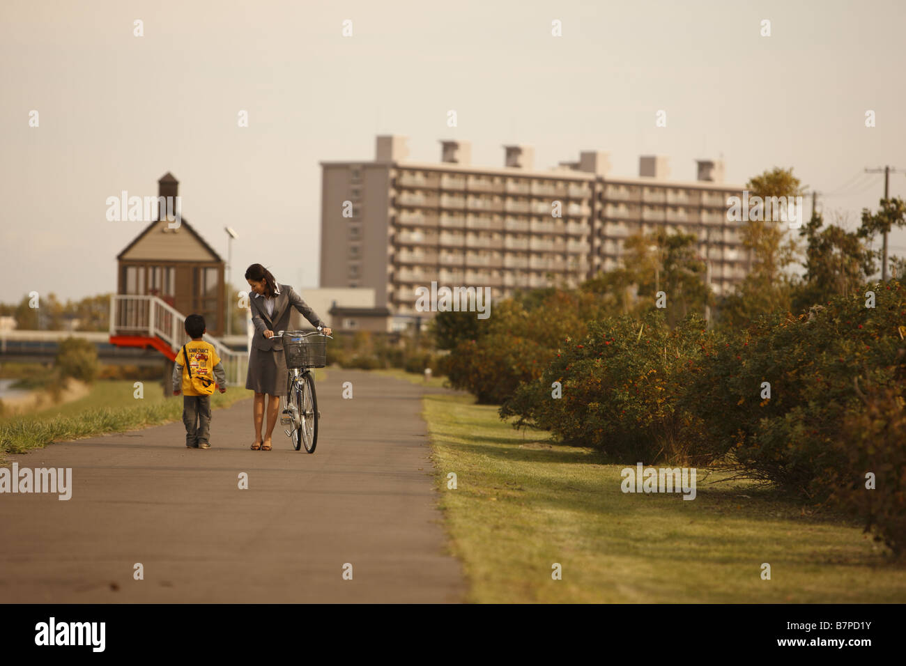 Mother and child on their way home Stock Photo - Alamy