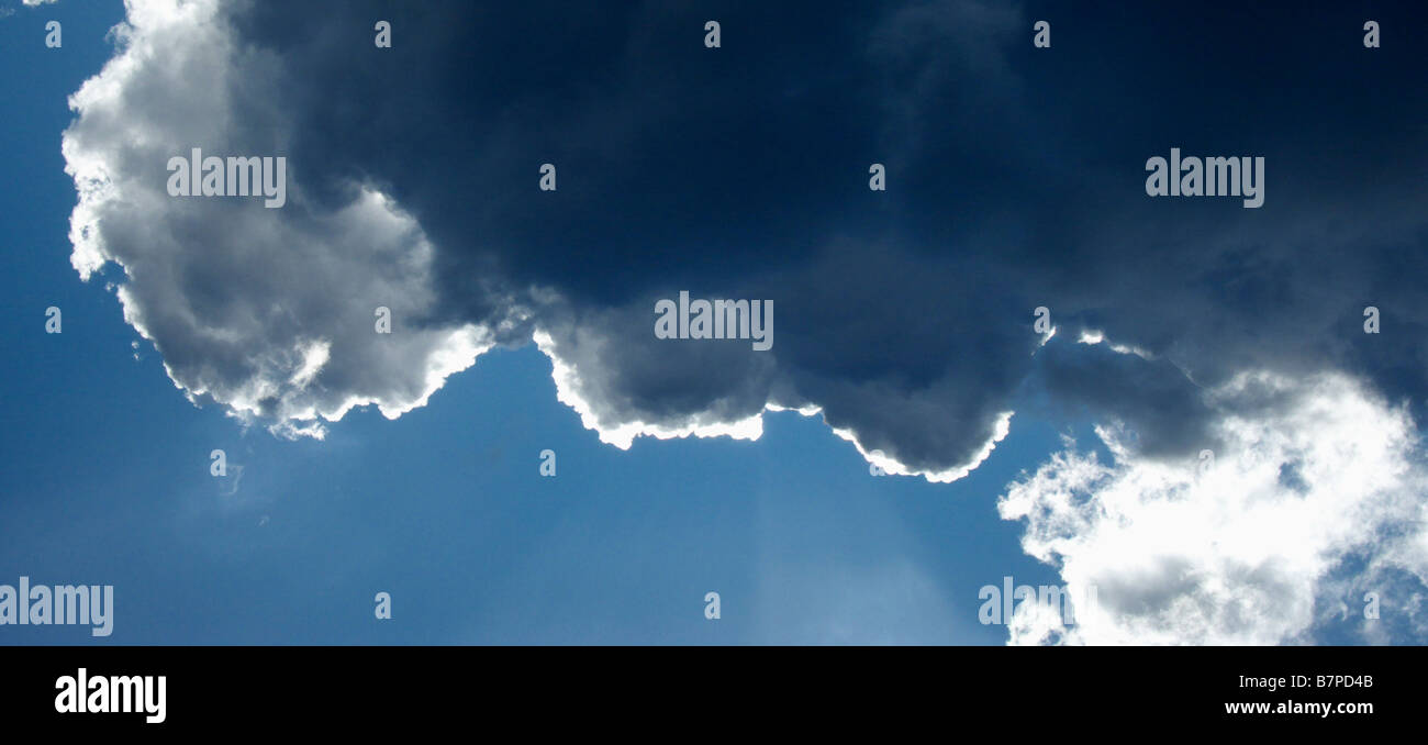 Dark cloud backlit by the sun Stock Photo - Alamy