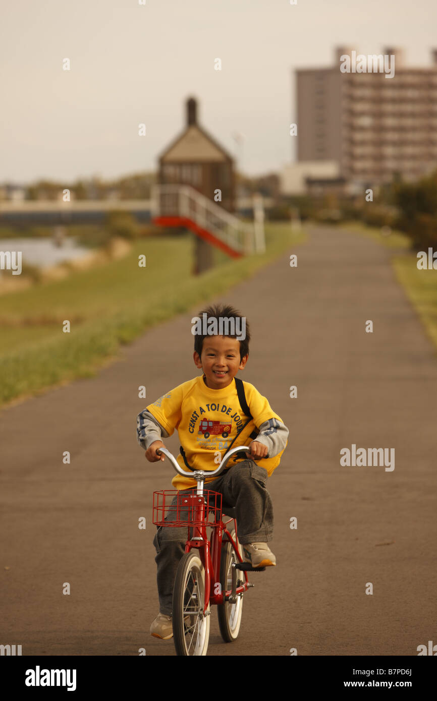 A boy riding a bicycle Stock Photo - Alamy