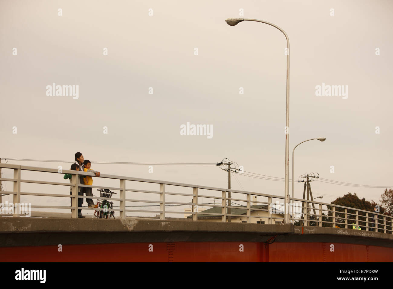 Mother and children on the bridge Stock Photo - Alamy