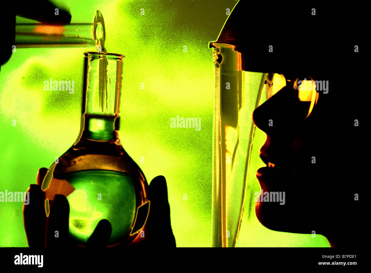 woman doctor examining contents of medical beaker Stock Photo - Alamy