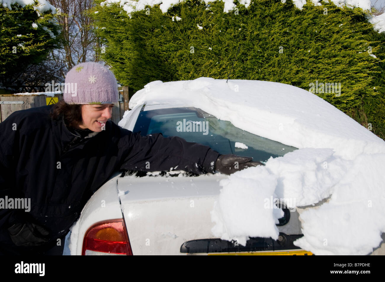 Woman cleaning snow windscreen hi-res stock photography and images - Alamy