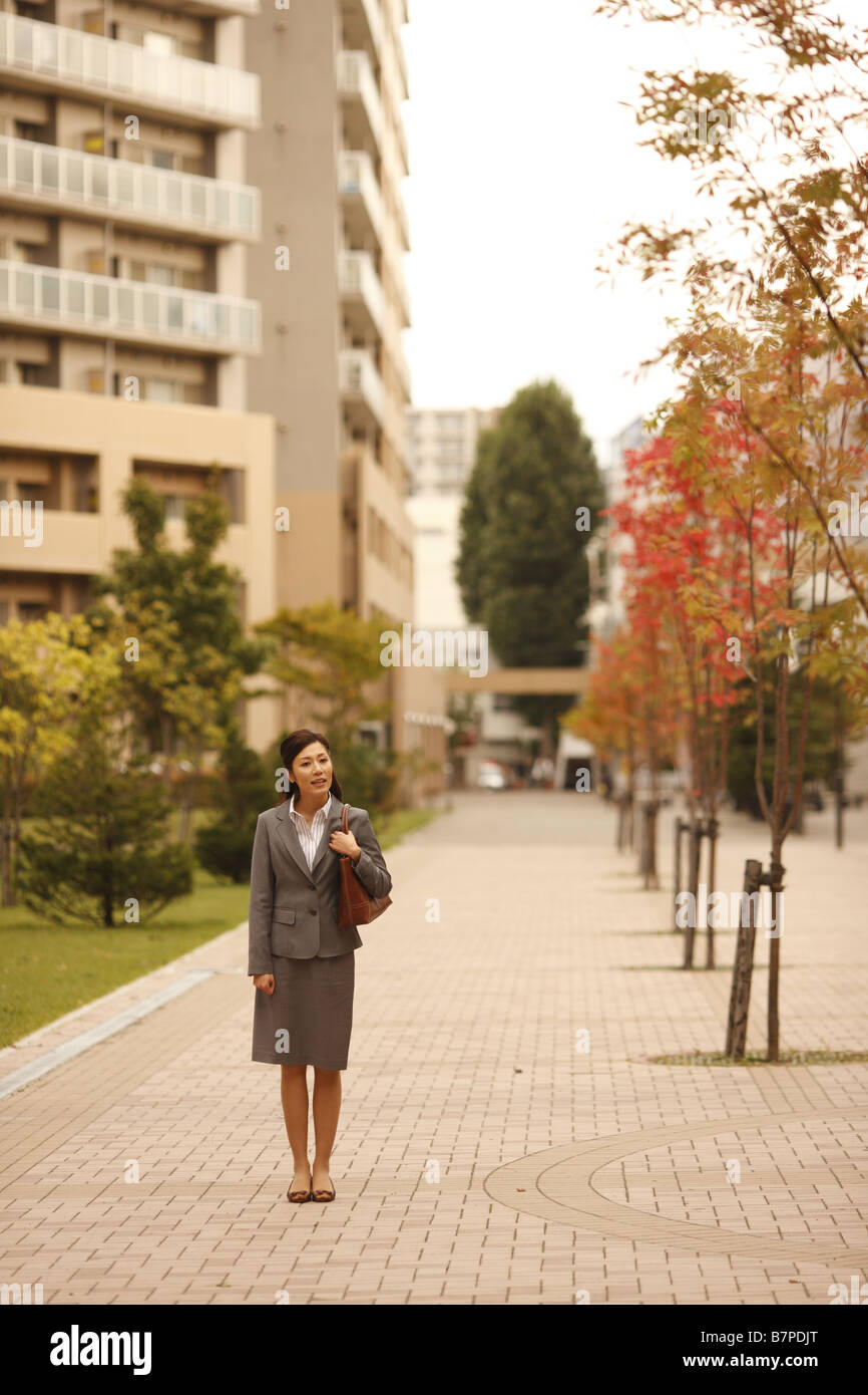 A woman coming home Stock Photo - Alamy