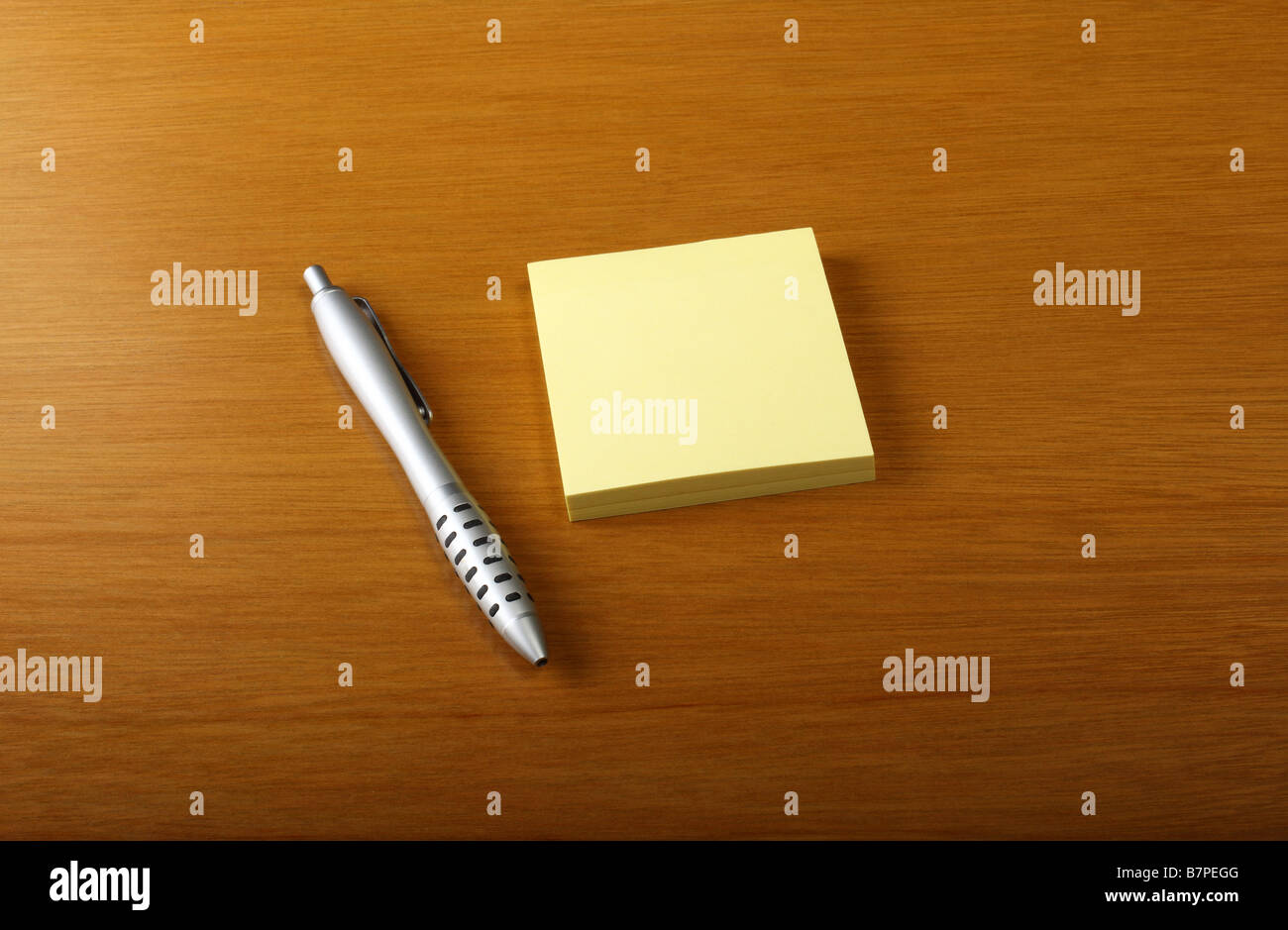 Pen and pad on desk Stock Photo - Alamy