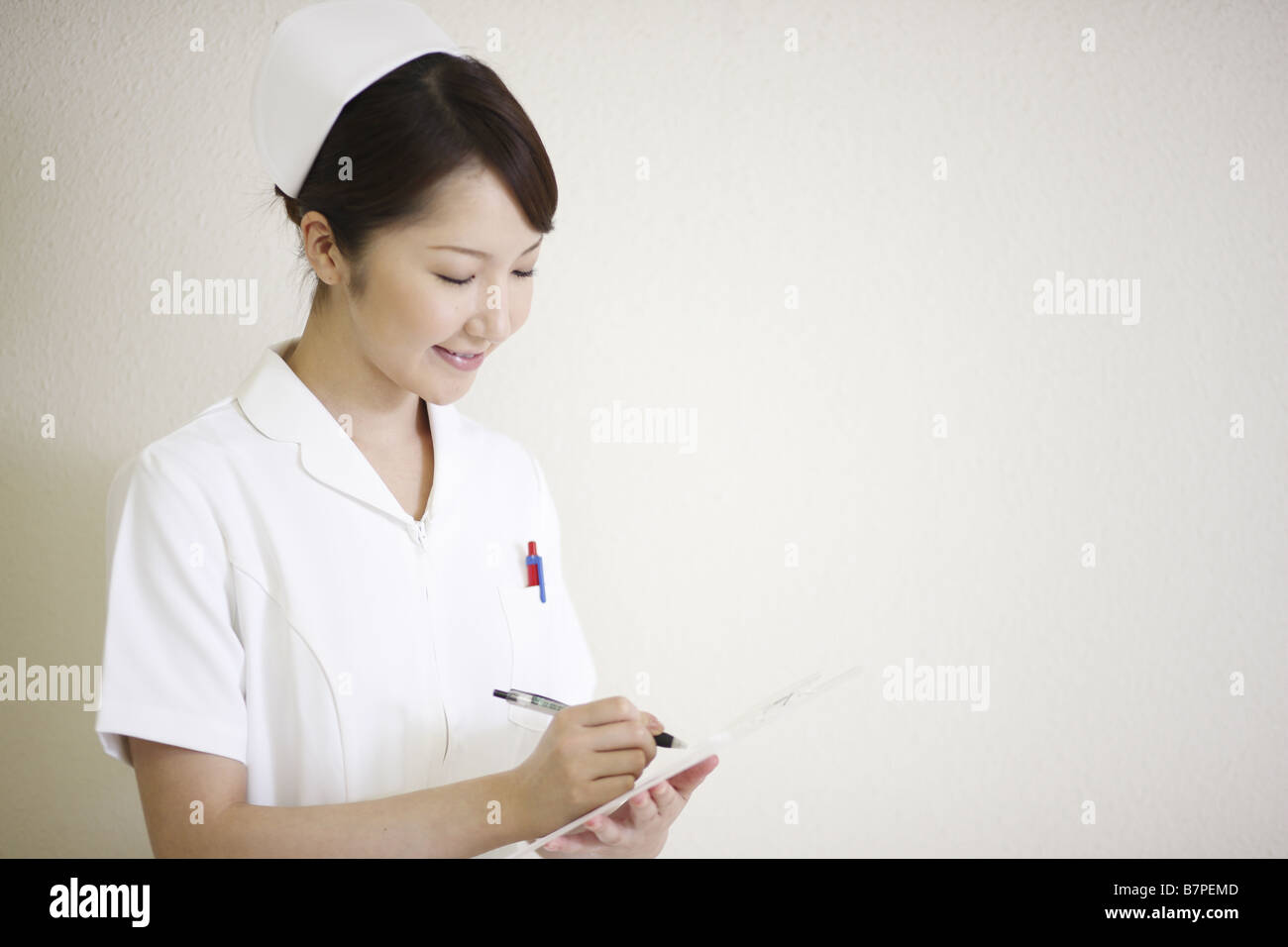 A nurse taking a note Stock Photo - Alamy