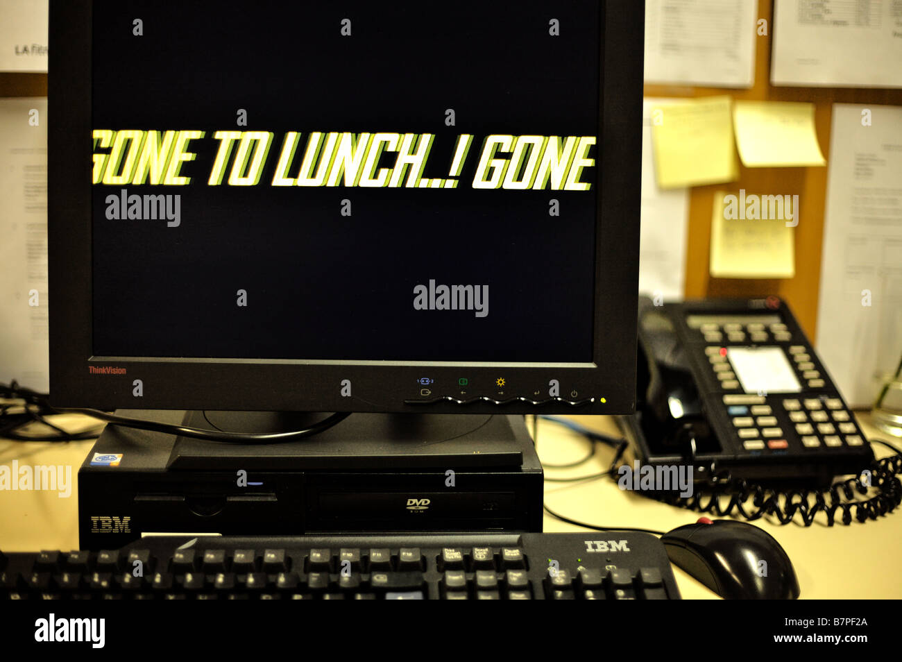 Yellow Gone to Lunch on Black Screen Saver at Office with phone in ...