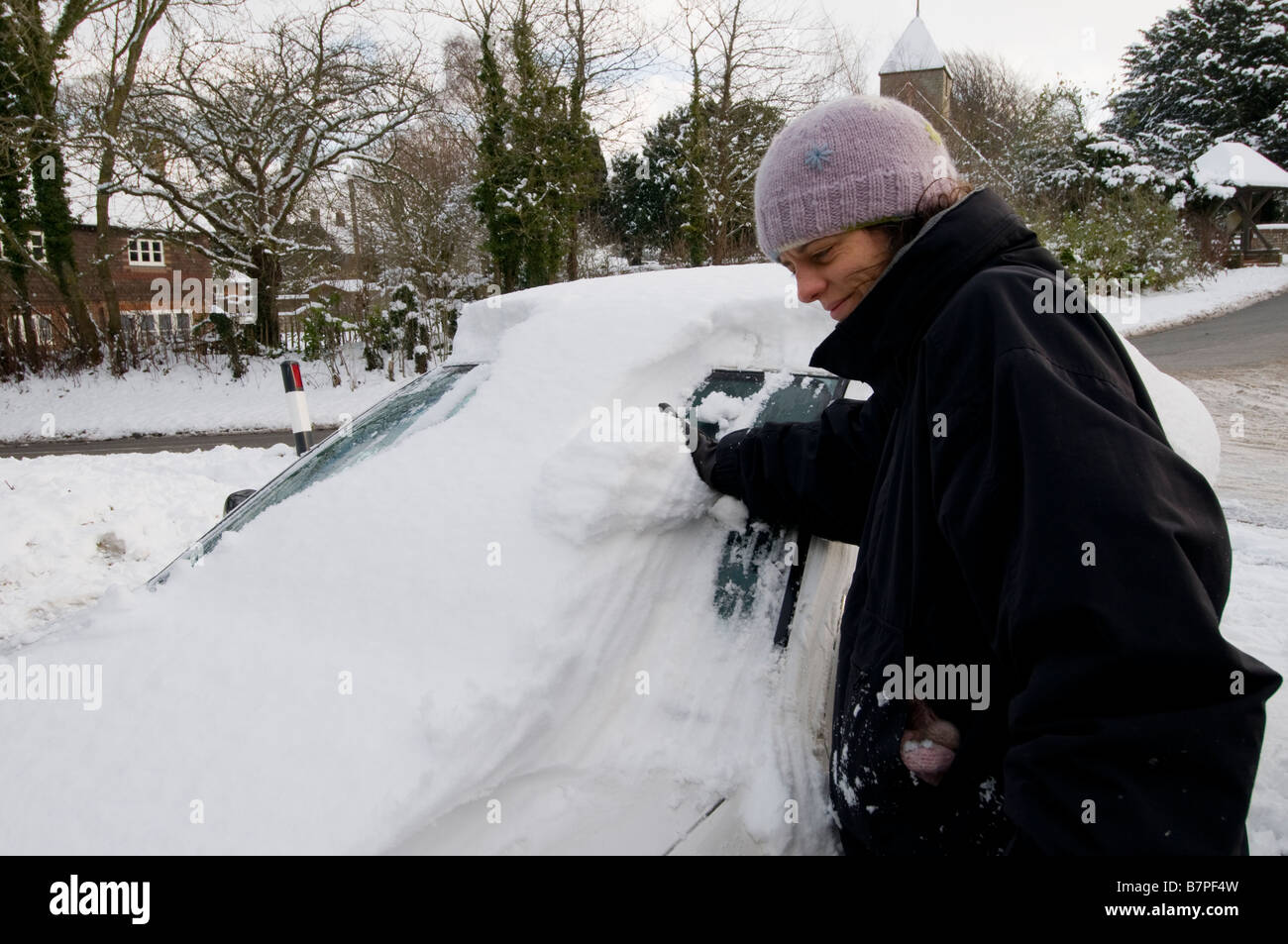 Woman cleaning snow windscreen hi-res stock photography and images - Alamy