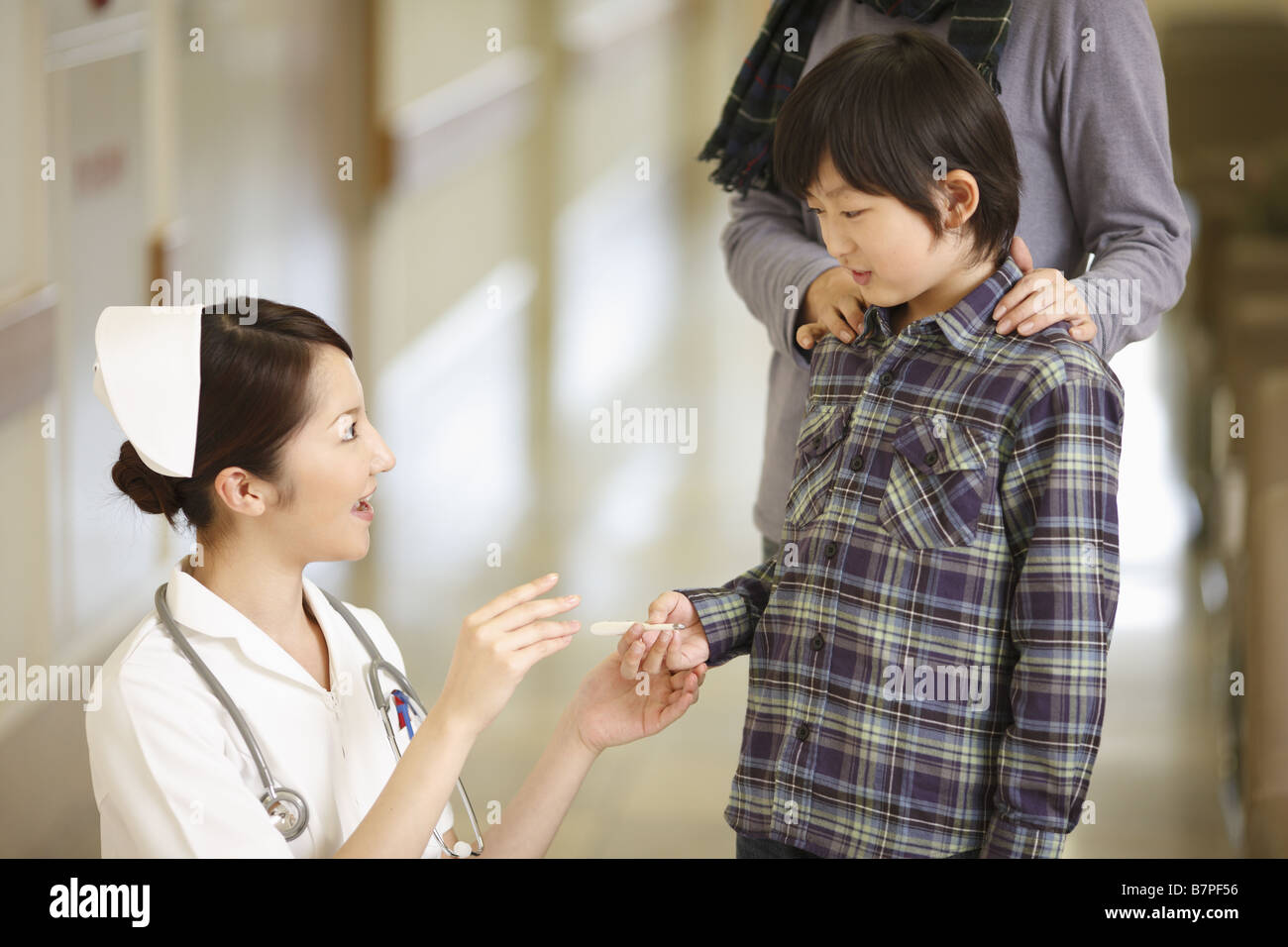 Nurse and a boy Stock Photo - Alamy