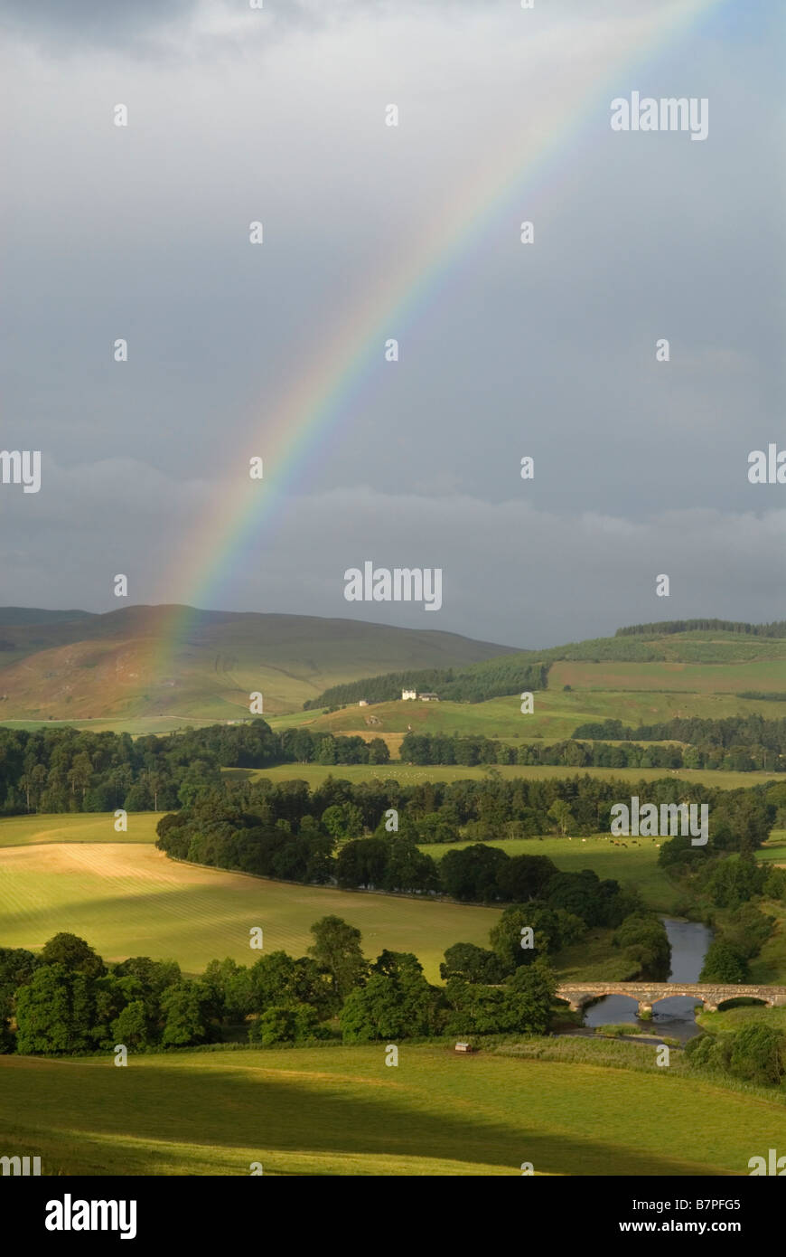 A rainbow over the River Tweed and bridge in Upper Tweeddale near ...