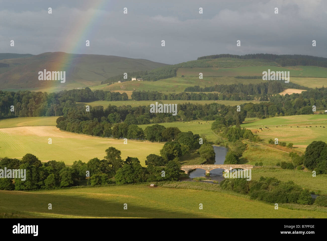 A rainbow over the River Tweed and bridge in Upper Tweeddale near ...