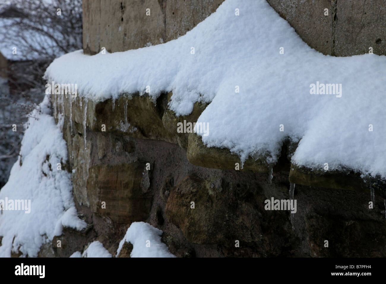 Snow on castle wall close up Stock Photo - Alamy
