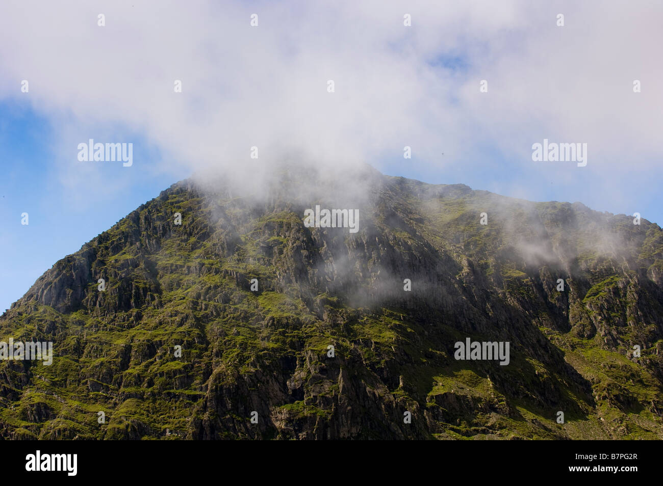 Mountain shrouded in clouds hi-res stock photography and images - Alamy