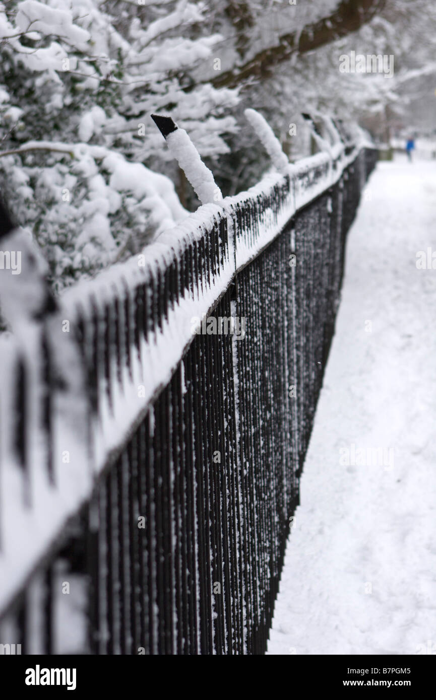 metallic fence covered with snow Stock Photo - Alamy