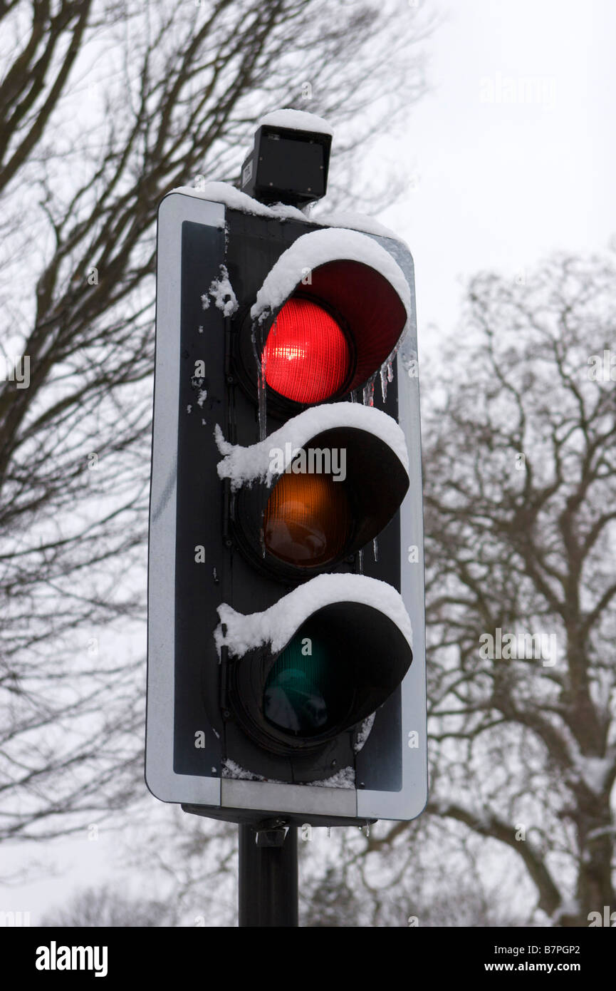 Red traffic light covered in snow Stock Photo - Alamy
