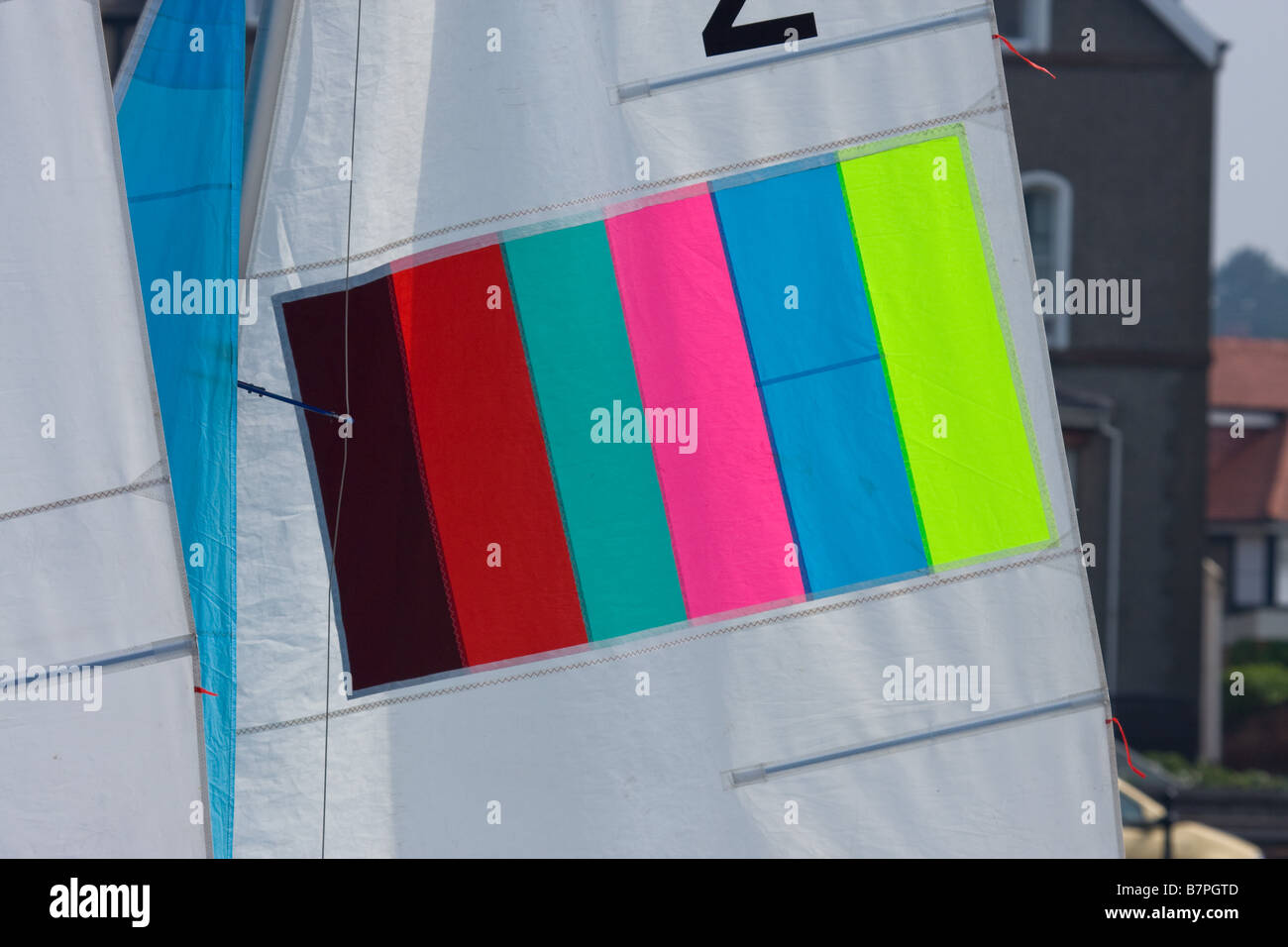 Multi-coloured colored stripes on the sail of a boat (dinghy Stock ...