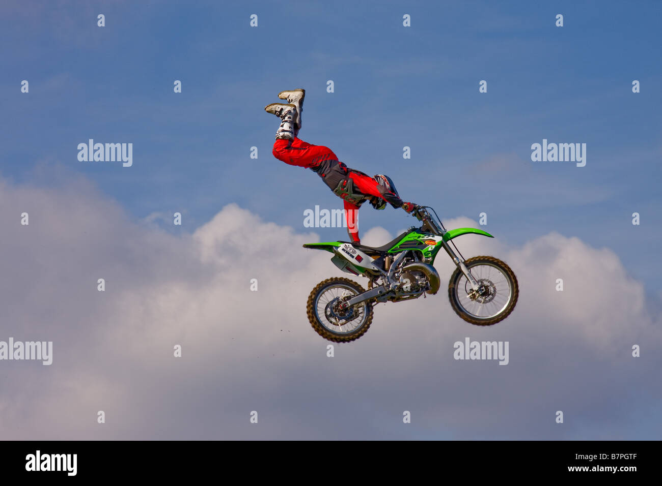 A daredevil stunt motorbike rider jumping through the air Stock Photo ...