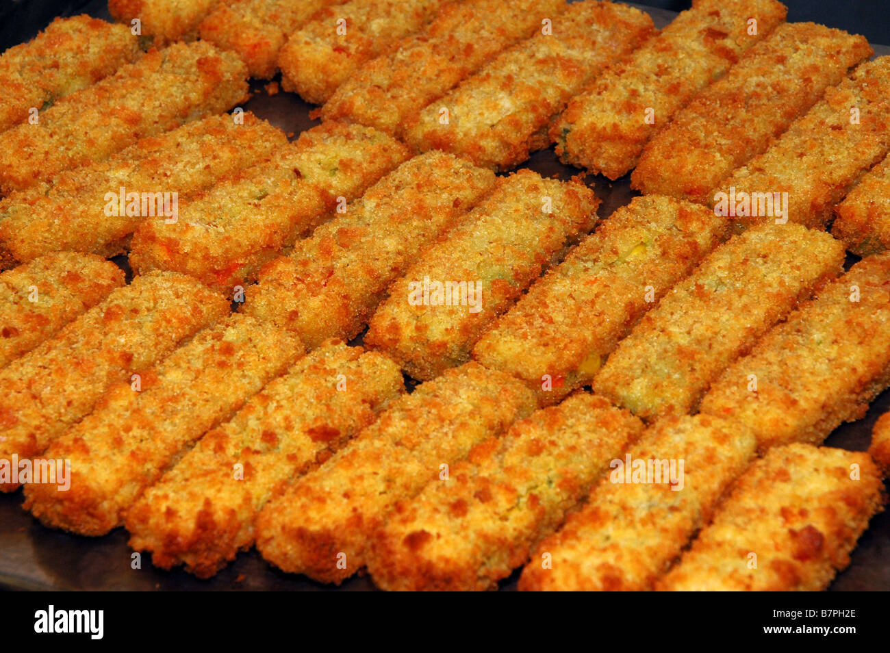 A baking tray full of vegetable fingers. - fish finger lookalikes Stock ...