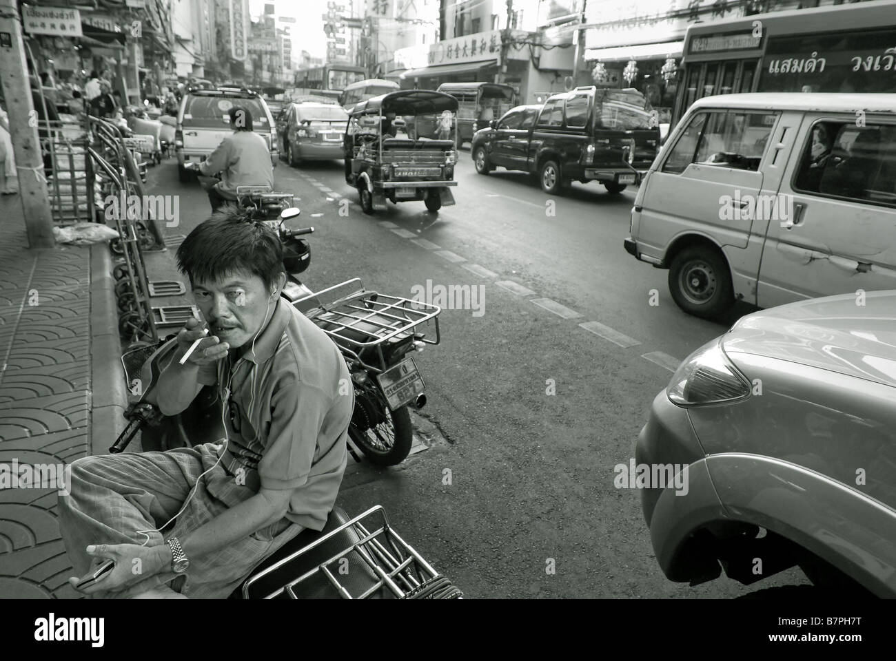 Man smoking cigarette on roadside hi-res stock photography and images ...