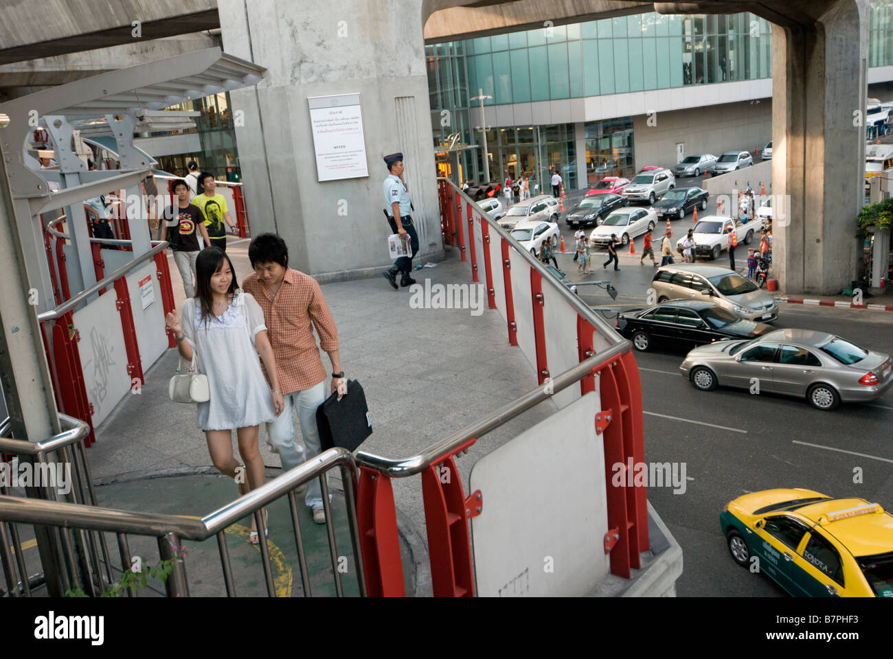Pedestrians using walkway above heavy traffic Pathumwan district in ...