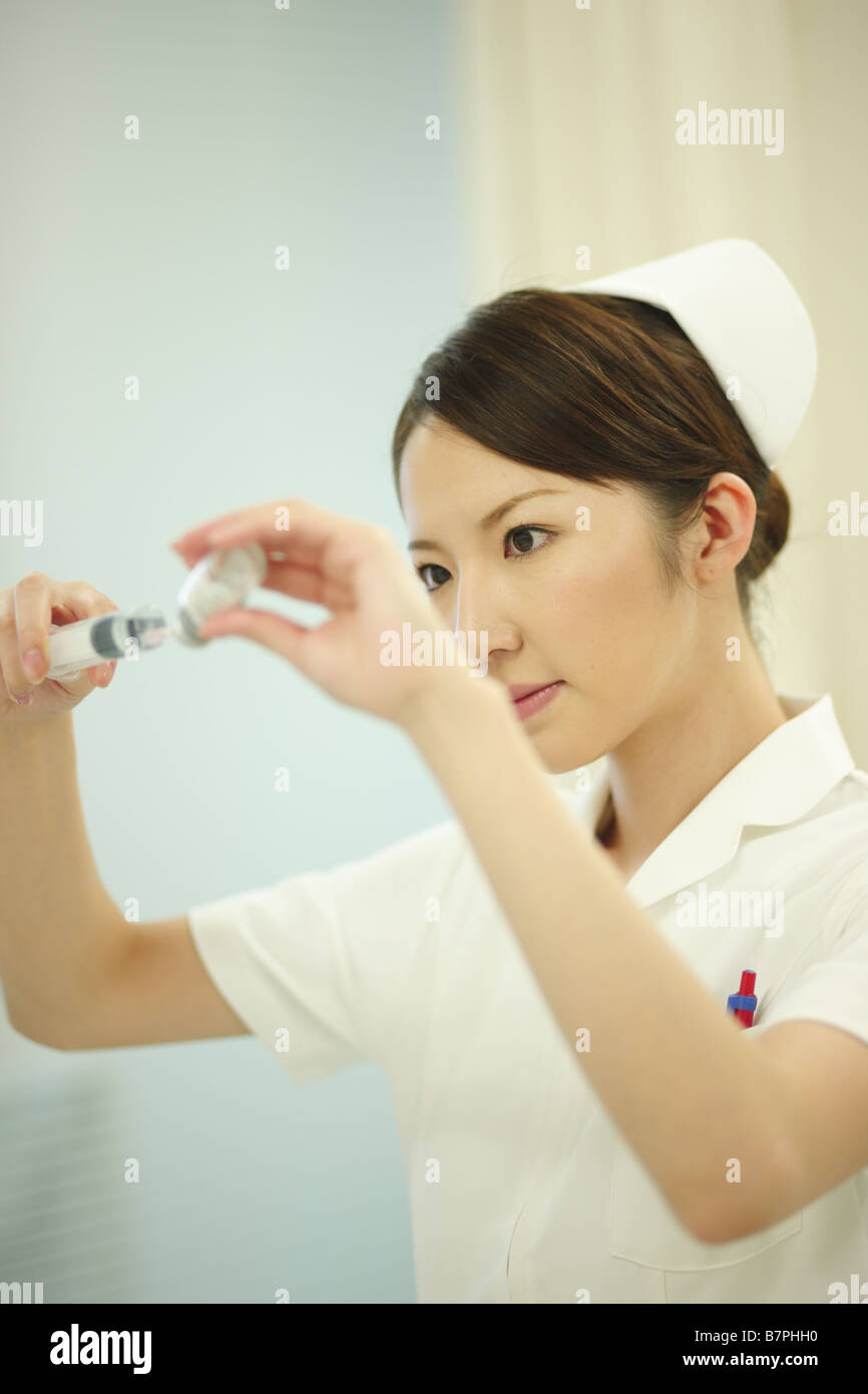 Nurse preparing for injection Stock Photo - Alamy