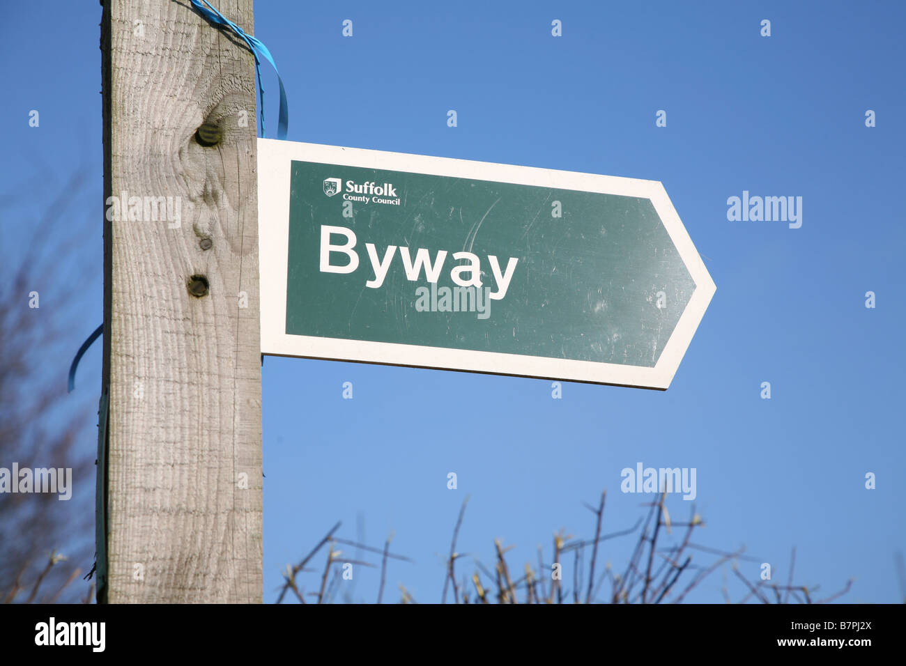 Signpost and sign arrow for public Byway against blue sky Stock Photo ...