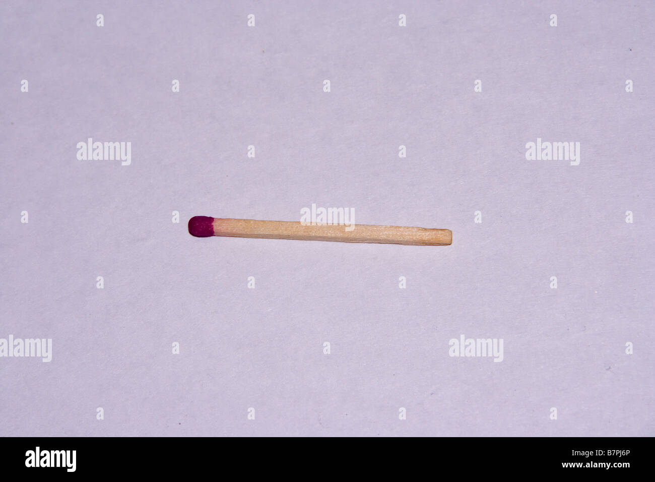 A single match on a white background Stock Photo - Alamy
