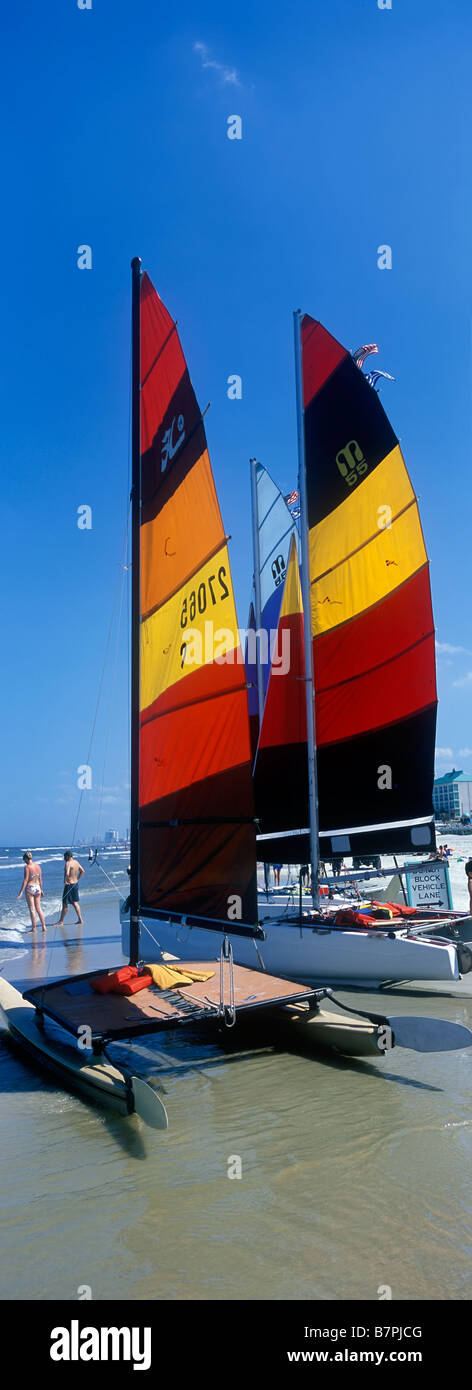 Two sailboats with colorful sails up on Daytona Beach Florida Stock ...