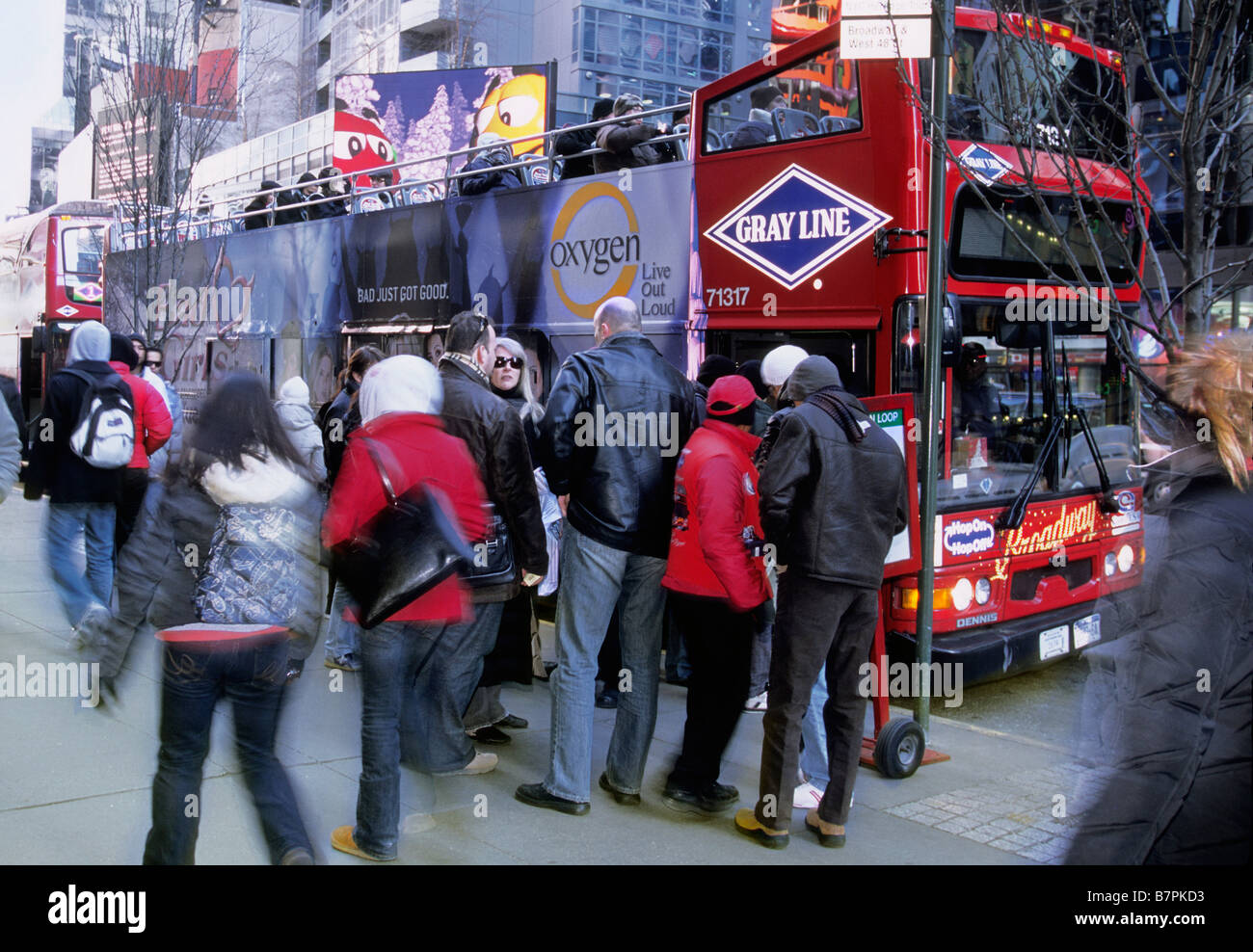 Crowd boarding bus stop hi-res stock photography and images - Alamy