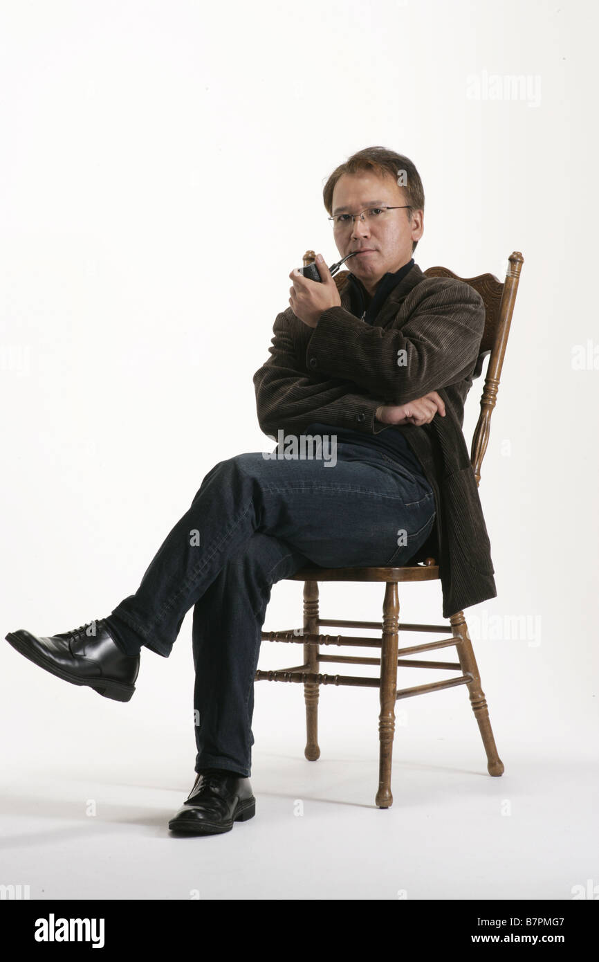 A man smoking the pipe Stock Photo - Alamy