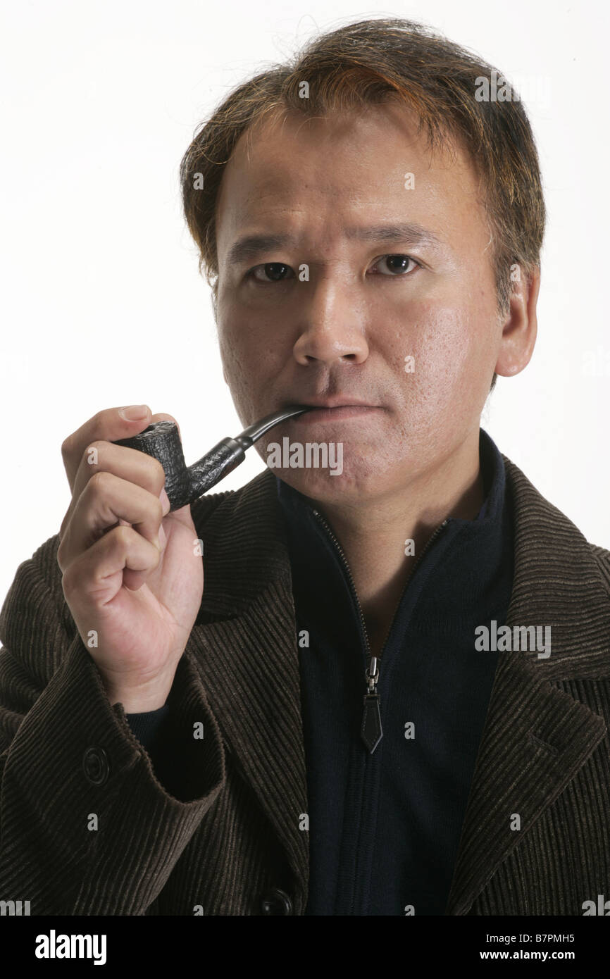 A man smoking the pipe Stock Photo - Alamy