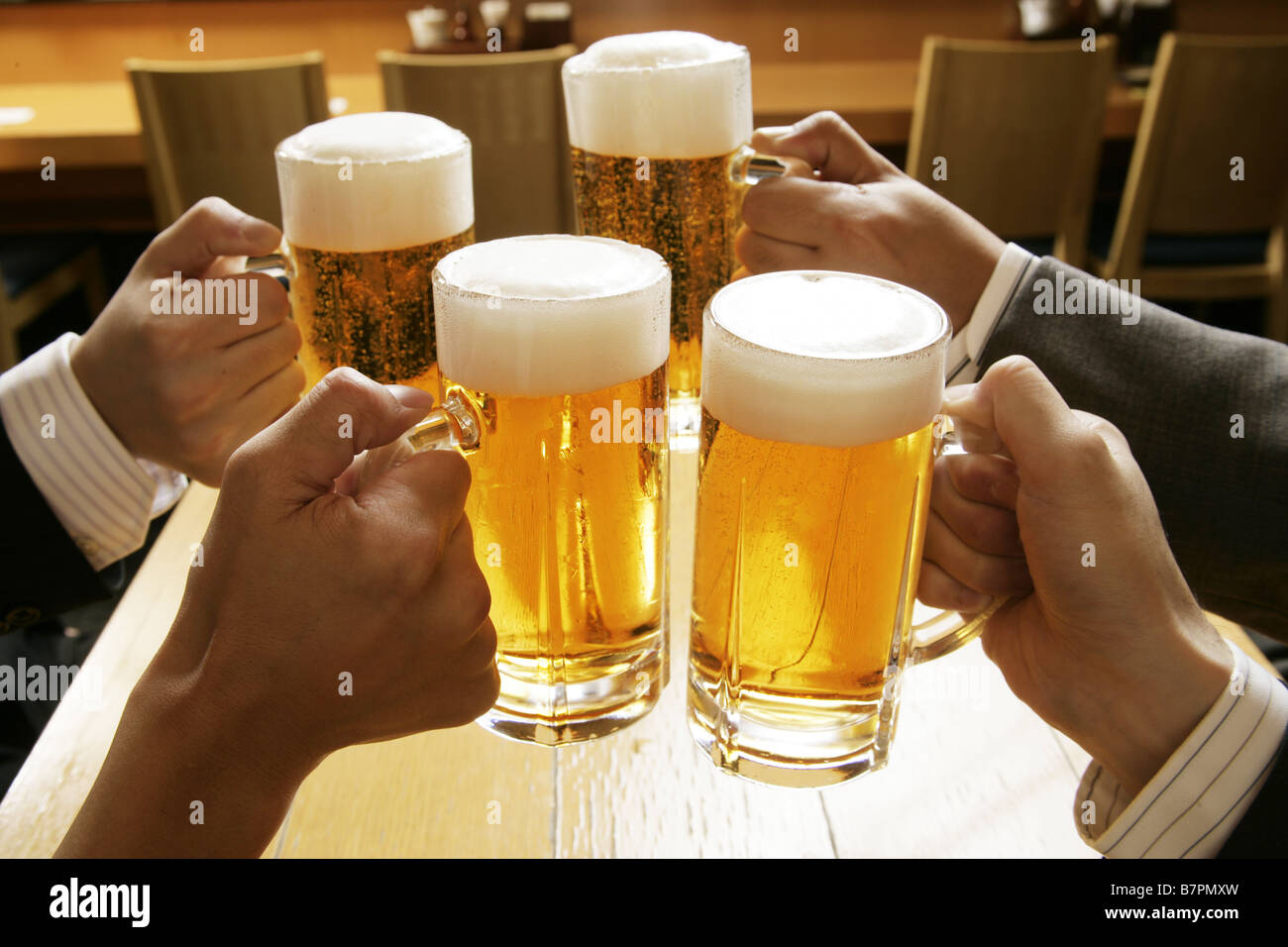 Making a toast with beer Stock Photo - Alamy