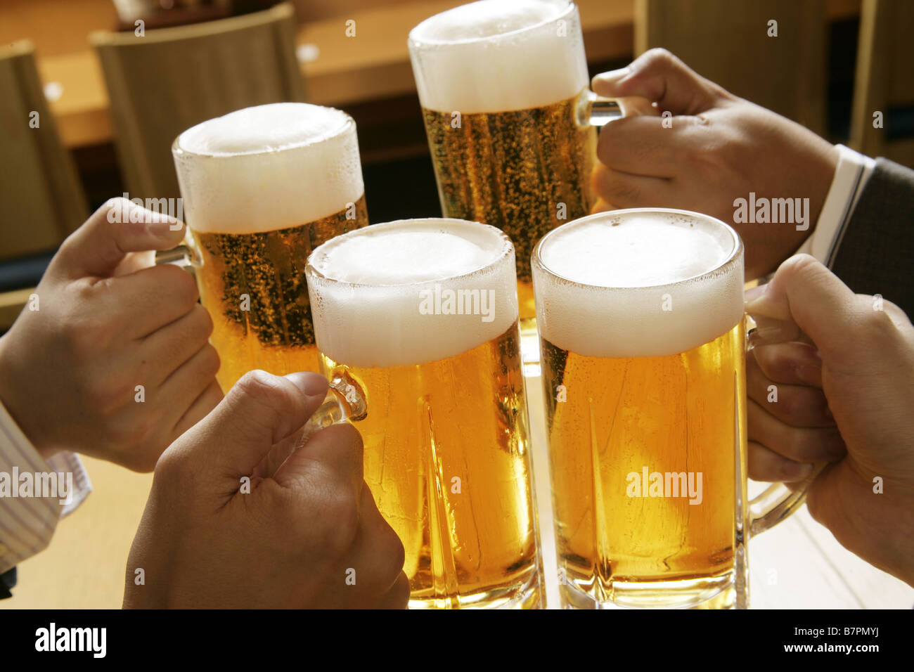 Making a toast with beer Stock Photo - Alamy