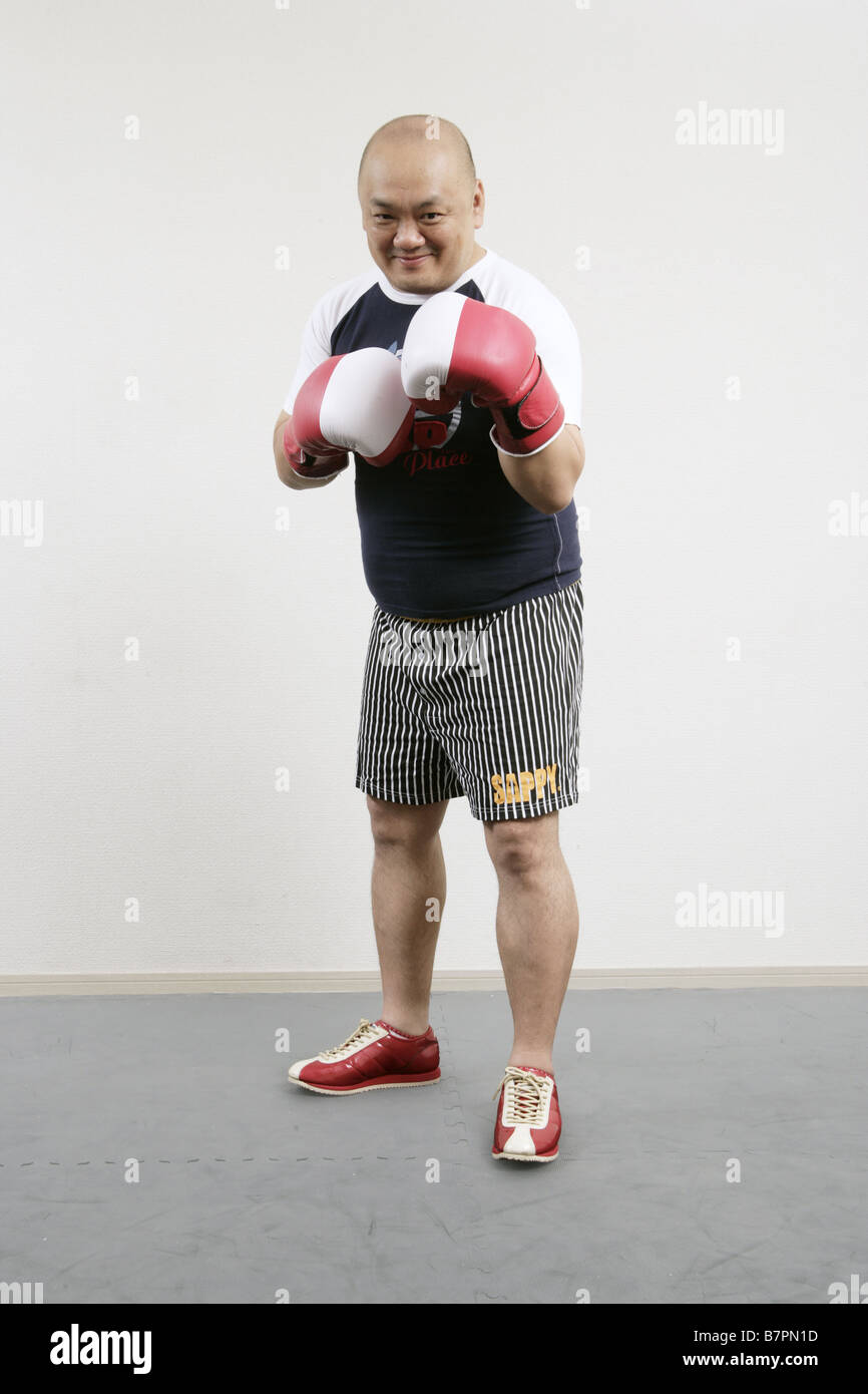 A man taking a fighting pose Stock Photo - Alamy