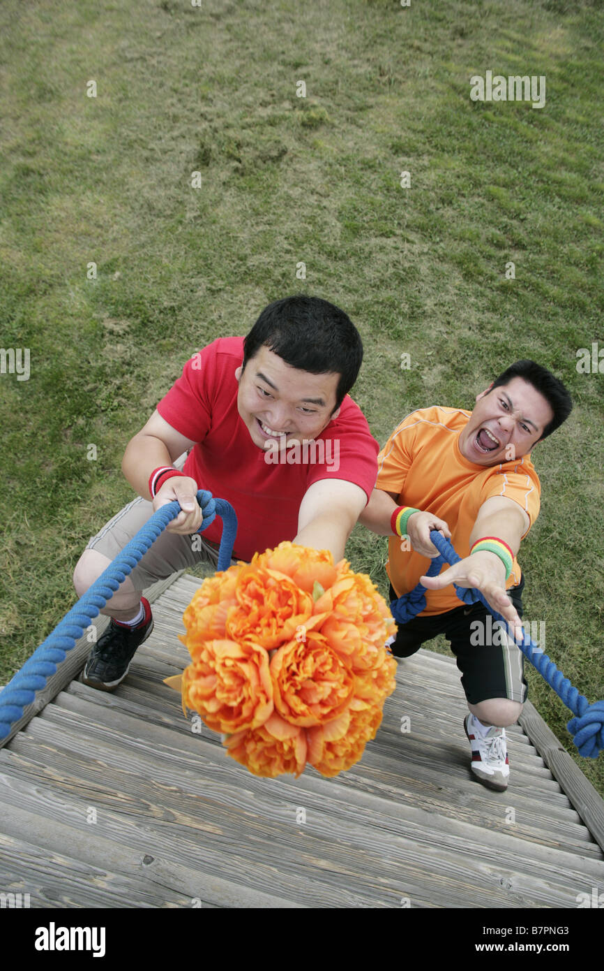 A man climbing up the play equipment Stock Photo - Alamy