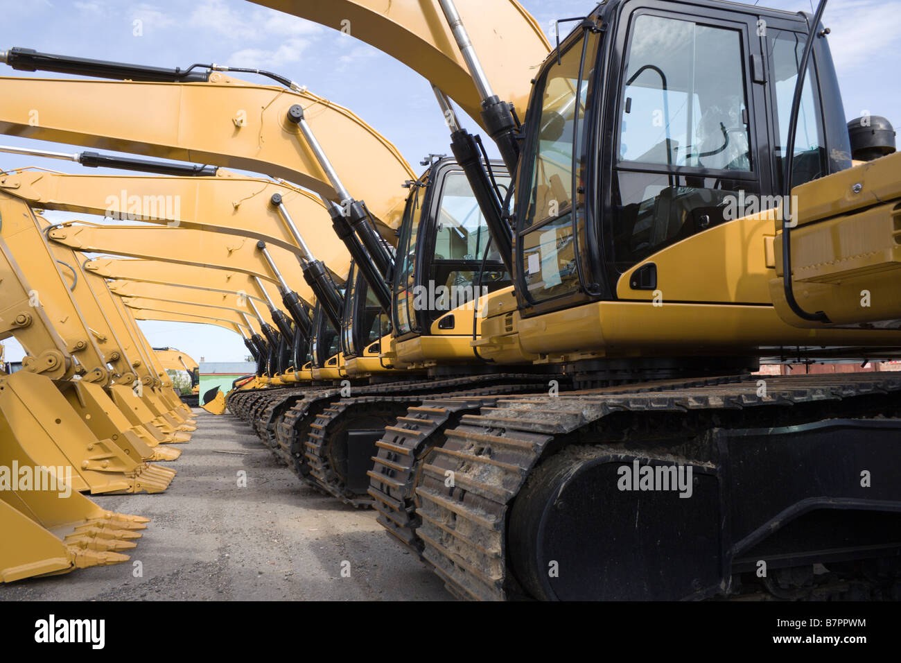 row of excavators Stock Photo - Alamy