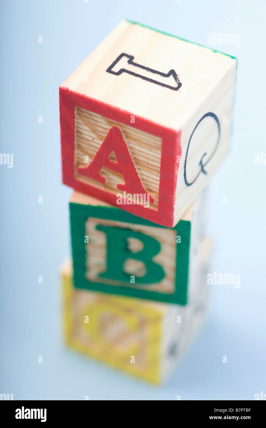 Wooden children's learning blocks stacked on shelf Stock Photo - Alamy