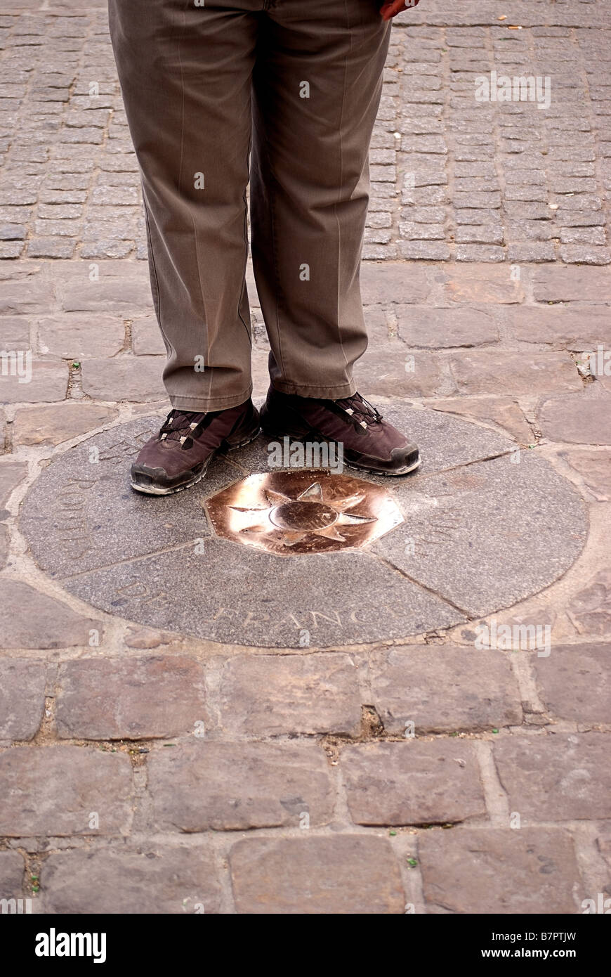 Man standing at Kilometre Zero in Paris France Stock Photo - Alamy