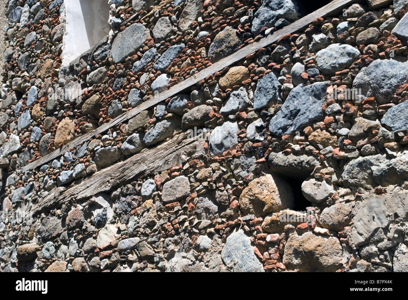 Coloured wall stones background of old abandoned building in mountain ...