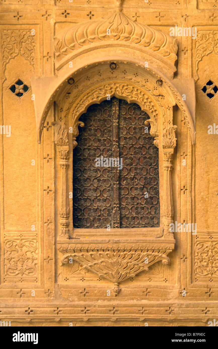 carved sandstone window with shutters in traditional indian haveli or ...