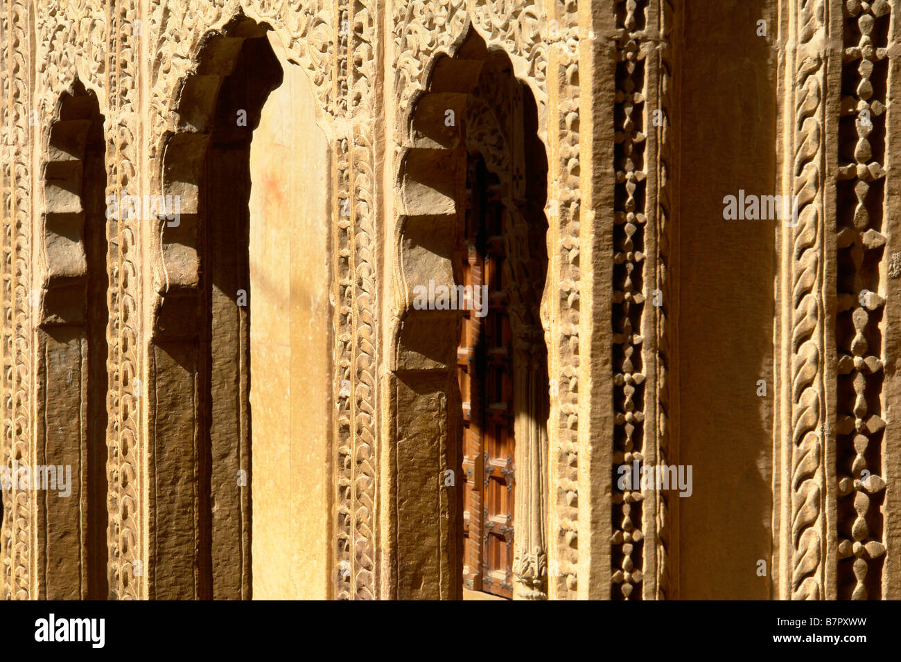 traditional sandstone carved arches in indian haveli or merchants house ...