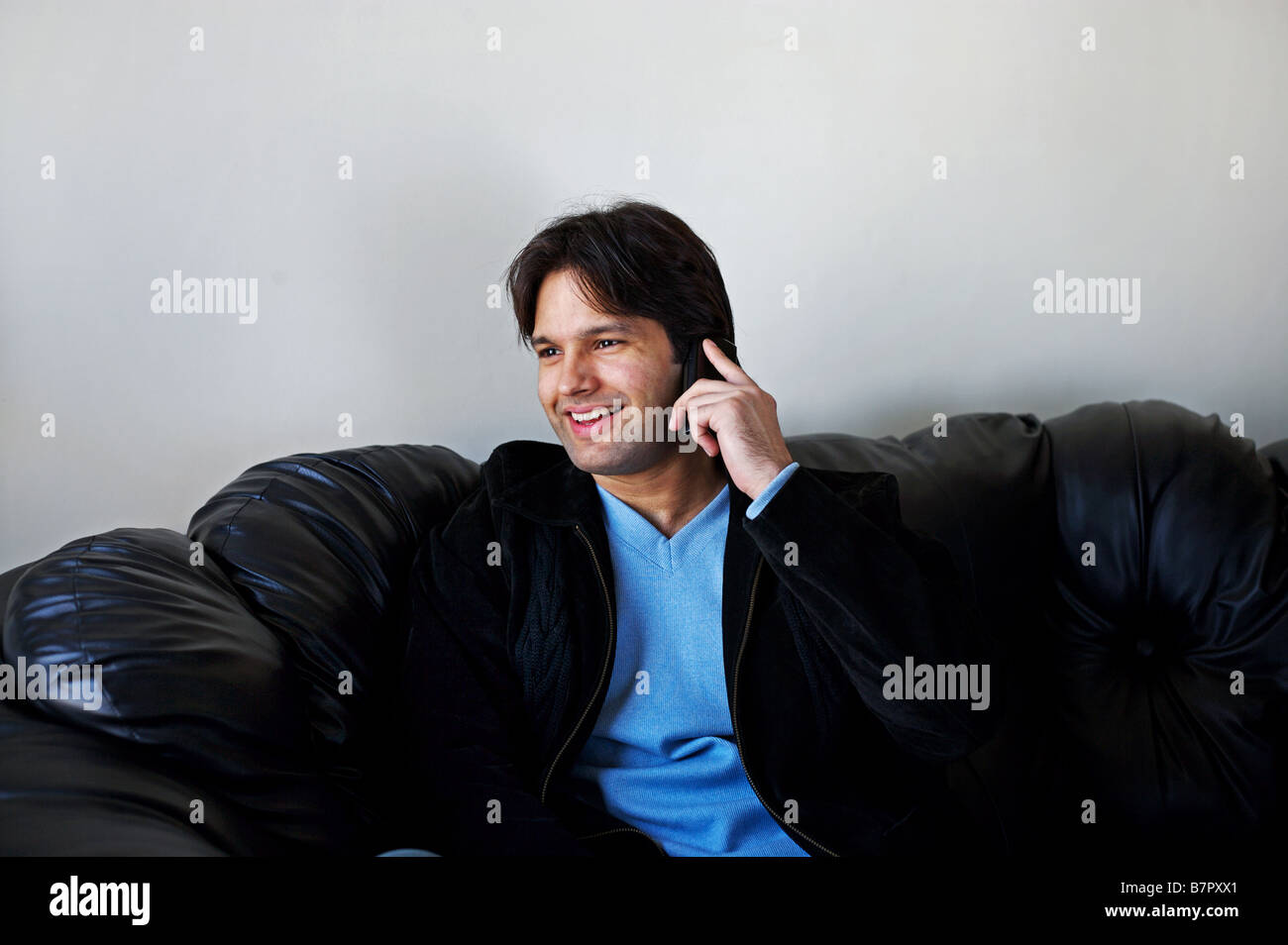 Man speaking on a cell phone Stock Photo - Alamy