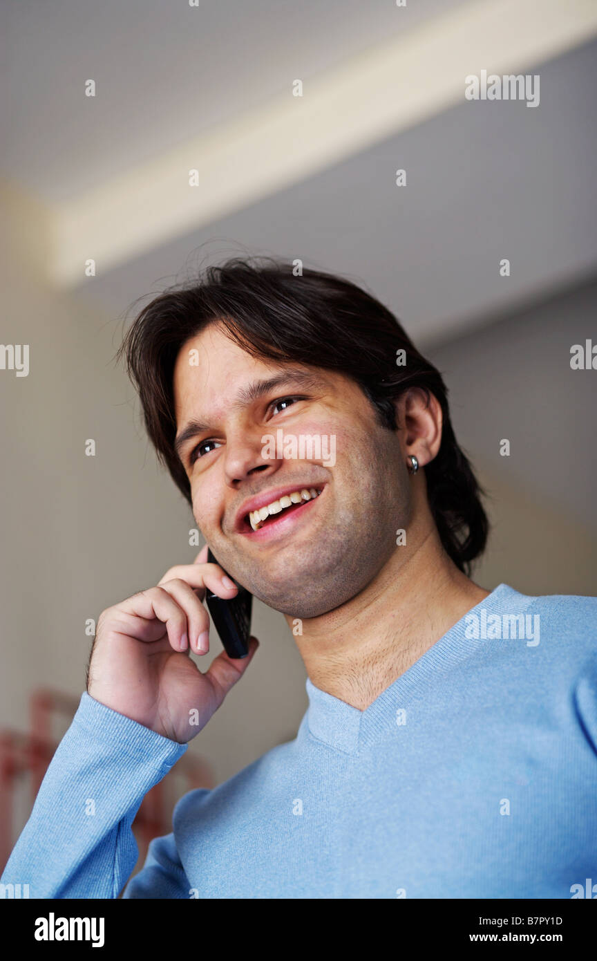 Man speaking on a cell phone Stock Photo - Alamy