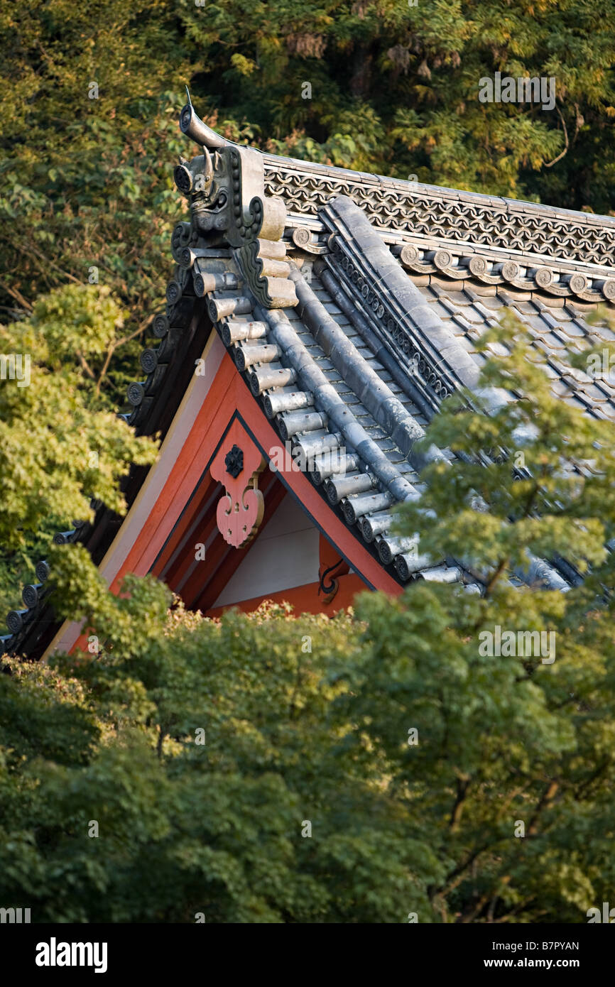 Trees and roof of a temple Stock Photo - Alamy