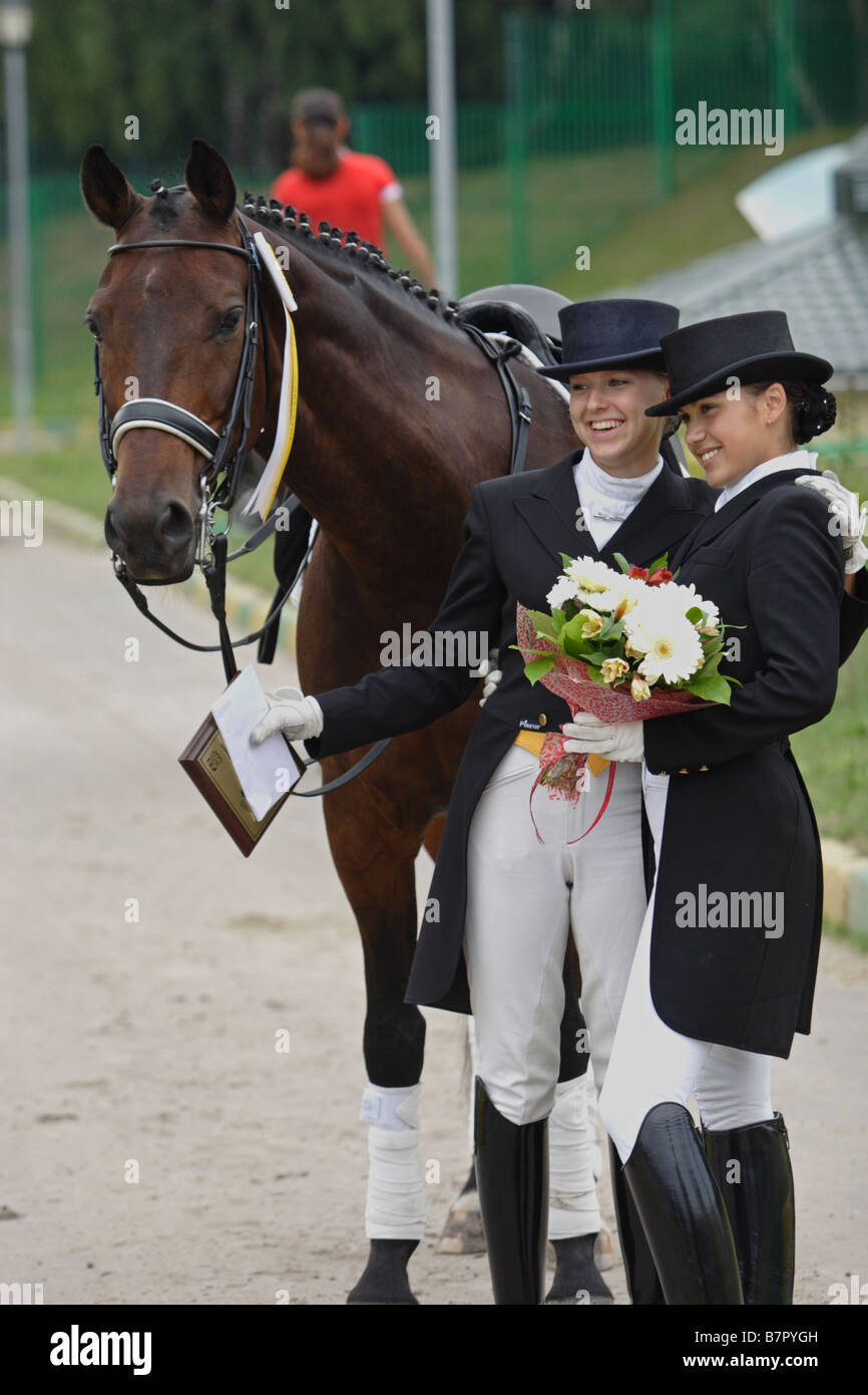 Dressage. Two equestrian girls Stock Photo - Alamy